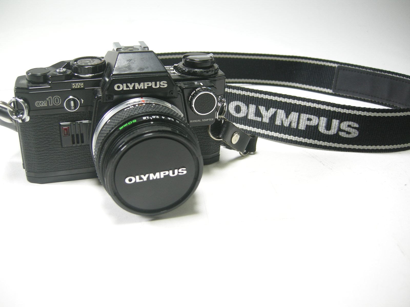 Olympus OM10 Black Body with Manual Adapter and 50mm f1.8 Lens – Camera ...